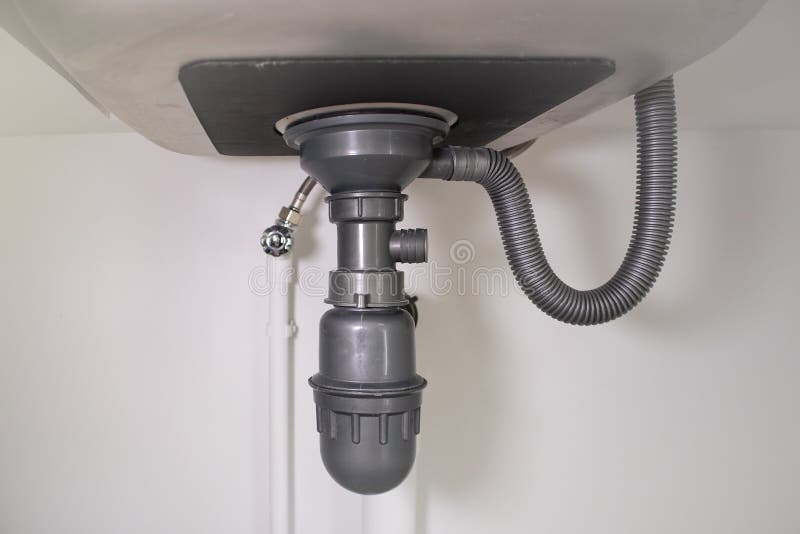 Sink and pipe in kitchen stock image. Image of house - 193108675