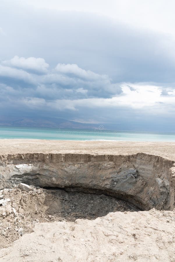 Sinkhole Filled with Turquoise Water, Near Dead Sea Coastline. Hole ... Sinkhole Filled with Turquoise Water, Near Dead Sea Coastline. Hole ...