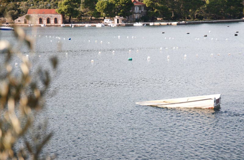 Sinking boat at sea stock photo. Image of waterway, boat - 303554868
