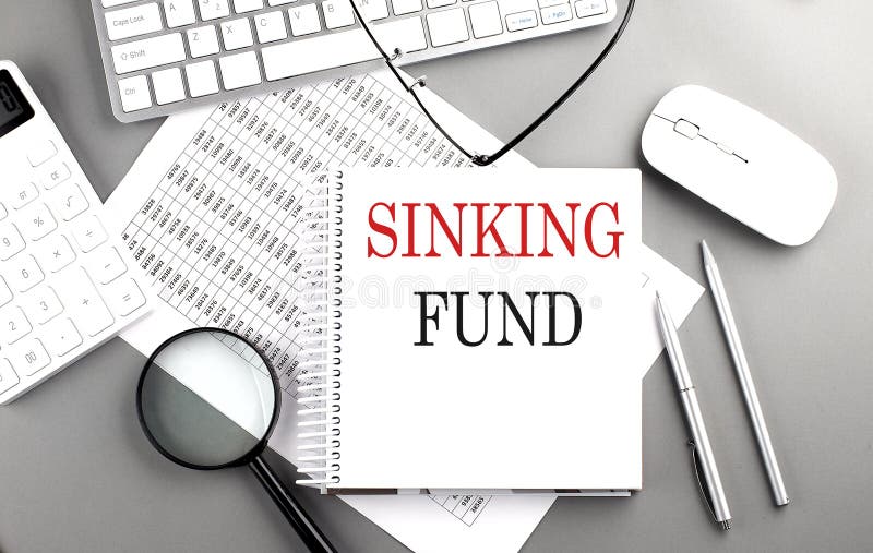Sinking Fund Concept with Notebook, Keyboard, and Magnifying Glass on ...