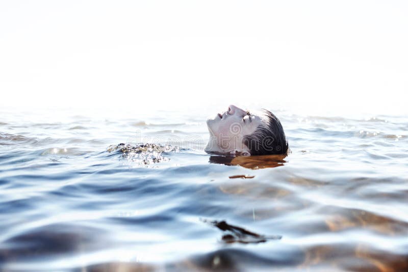 Sinking in the Problems. Young Man Experiencing Stock Photo - Image of ...