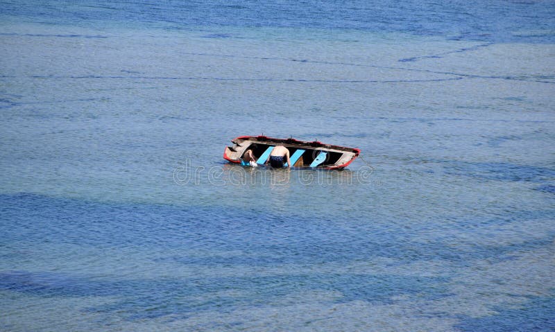 Sinking Ship. 2 People Trying To Get on a Sinking Ship Stock Image ...
