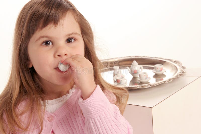 Sip of tea stock image. Image of miniature, pink, face - 536711