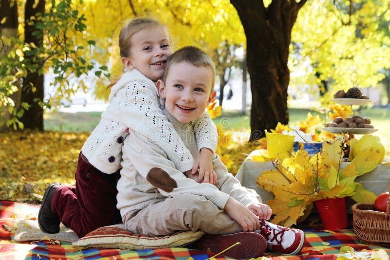 Sister and Brother Hugging Under Autumn Tree Stock Photo - Image of ...