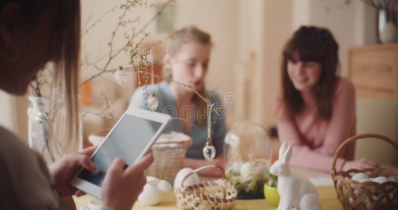 Sisters Browsing Smartphones Social Media during Easter Breakfast Stock ...