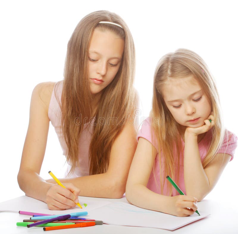 Sisters draw on the album stock photo. Image of friends - 41583902