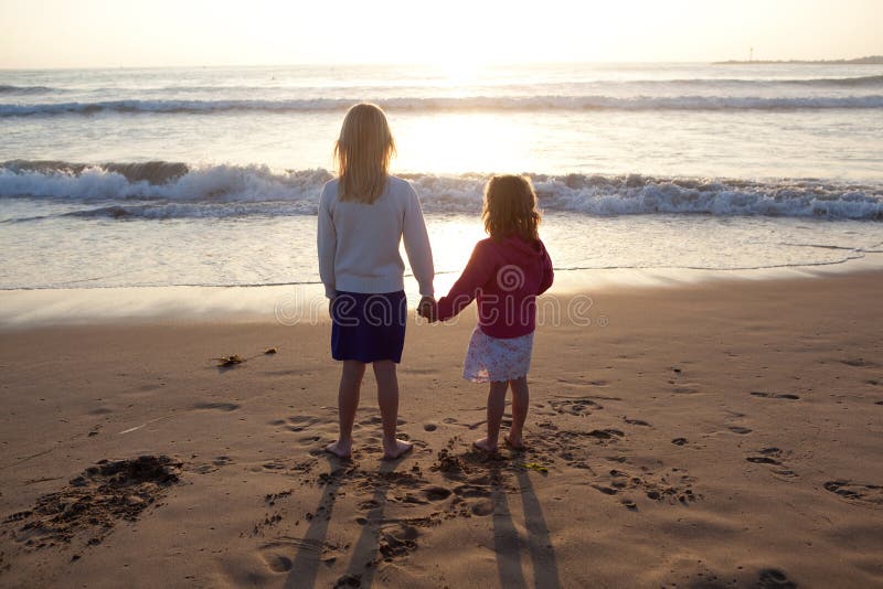 Three Sisters Holding Hands Stock Photo - Image of ocean, barefoot: 2504288
