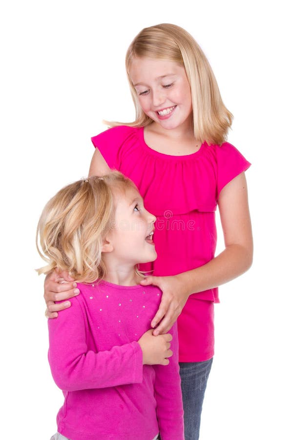 Sisters Hugging and Looking at Each Other Stock Image - Image of ...
