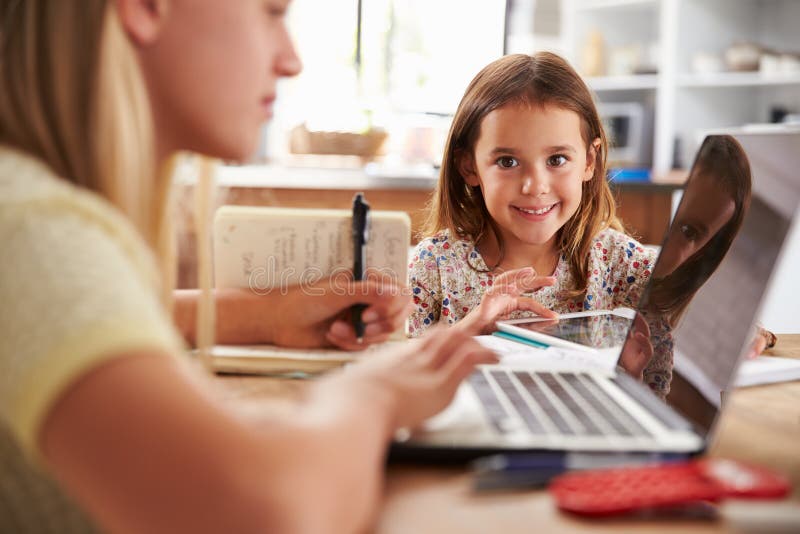 Sisters Spending Time Together with Computers at Home Stock Image ...