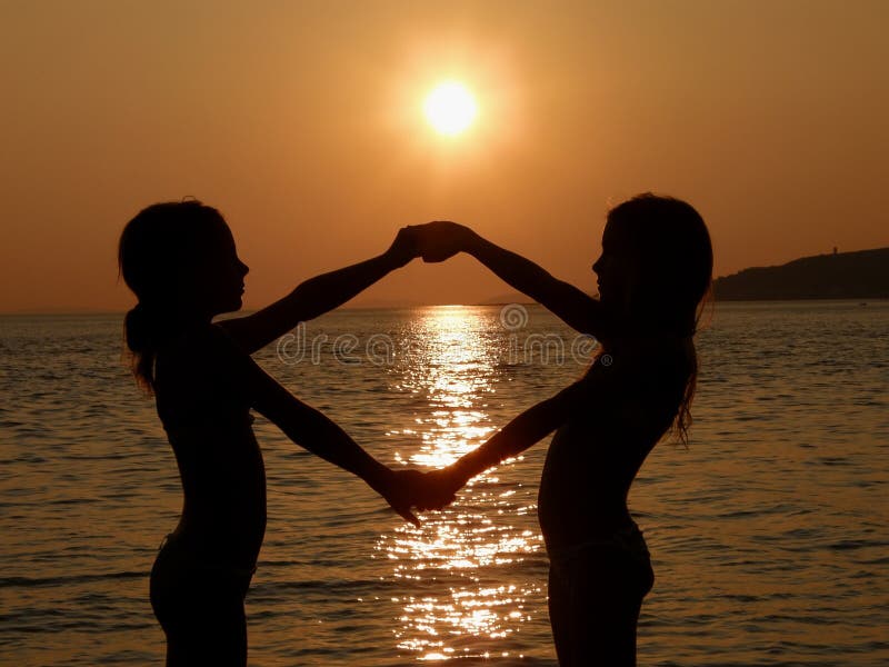 Sisters in summer sunset stock image. Image of calm, golden - 13201405