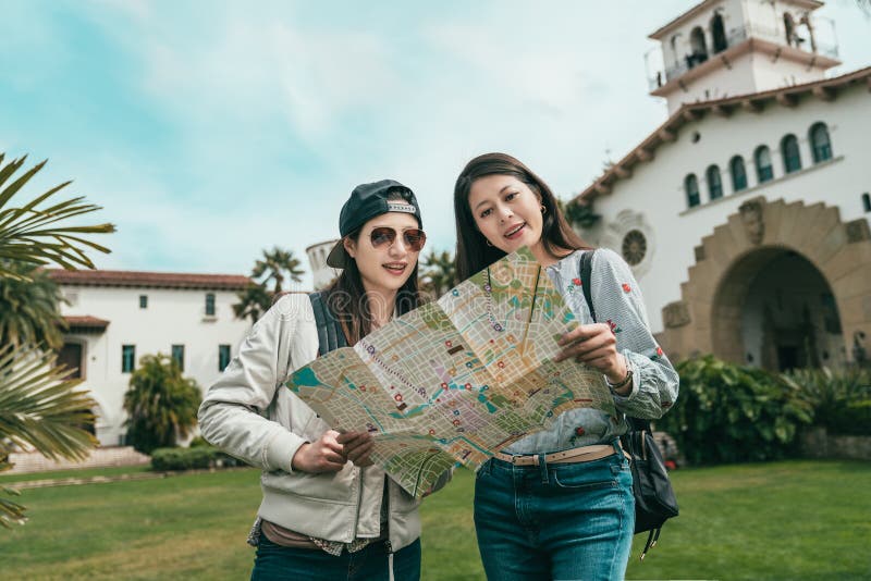 Sisters Visiting Beautiful Building with Guide Map Stock Photo - Image ...