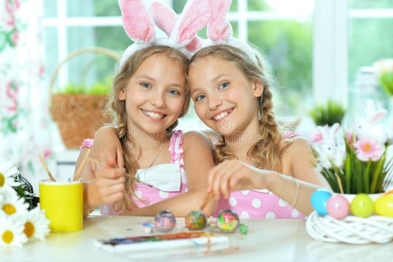 Sisters Wearing Rabbit Ears Decorating Easter Eggs at Home Stock Photo ...