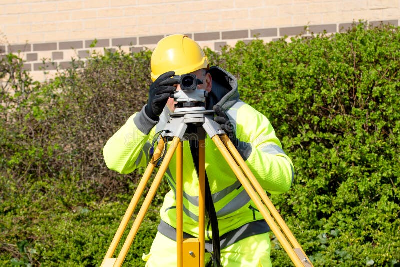 Site Engineer Checking Levels of the Road Using Autolevel Stock Photo ...
