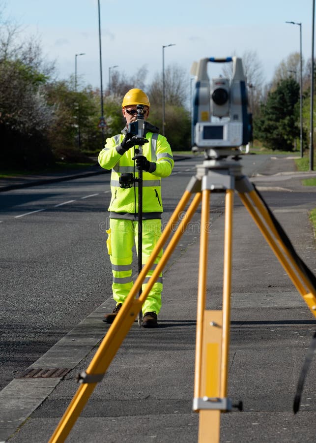 Robotic Total Station Set by Construction Site Engineer Next To Manhole ...
