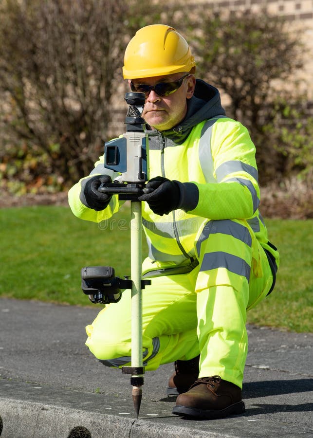 Robotic Total Station Set by Construction Site Engineer Next To Manhole ...