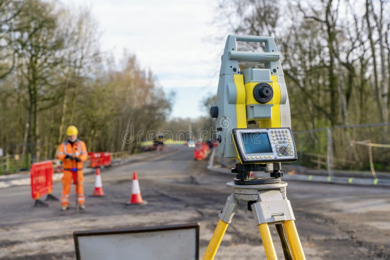 Site Engineer Operating His Instrument during Roadworks. Builder Using ...