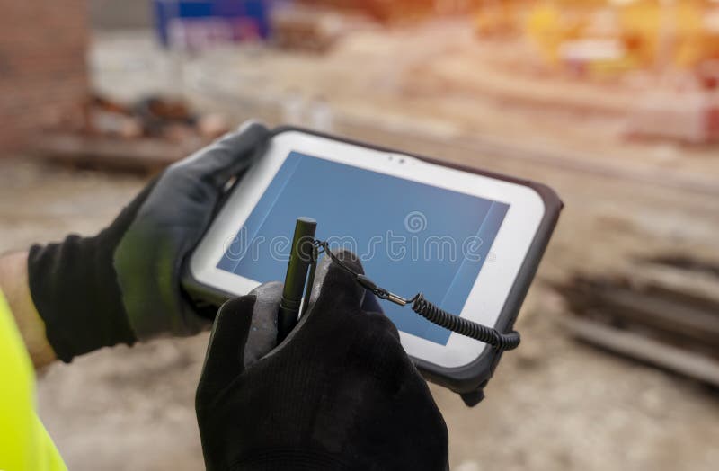 Site Engineer Surveyor Using Rugged Tablet Controller Computer To ...
