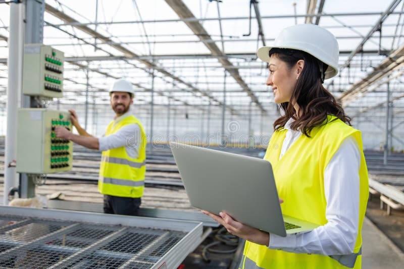 Two Engineers Inspecting Construction Site and Looking Involved Stock ...
