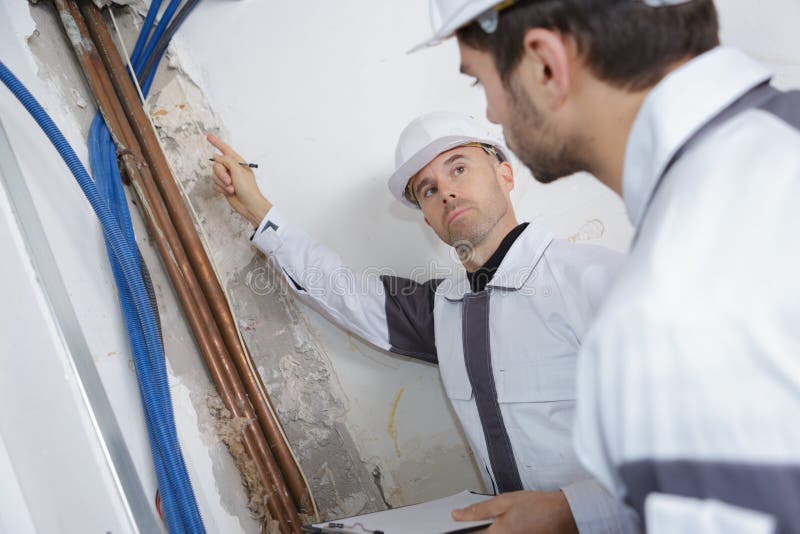 Site Inspector Inspecting Wall Stock Image - Image of male ...