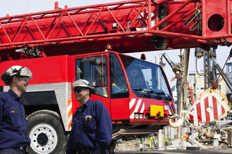 Giant Mobile Cranes and Building Workers Stock Image - Image of site ...
