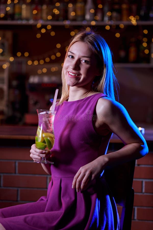 Sitting alone at the bar stock image. Image of club, dress - 61587997