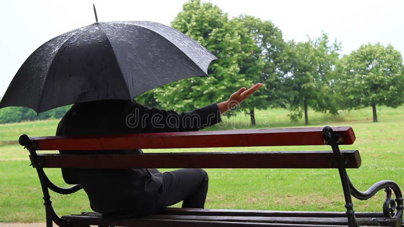 Sad Man Sitting on the Rain on the Streets Stock Footage - Video of ...