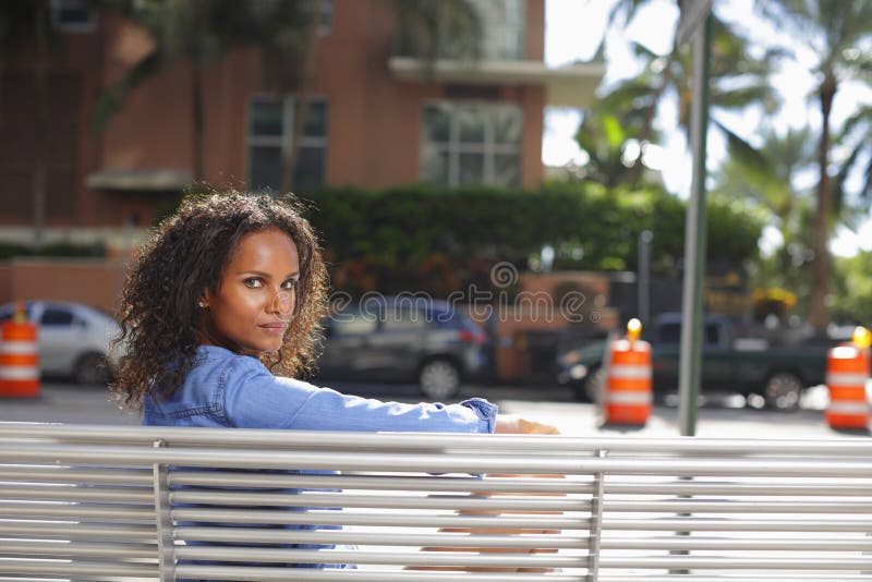 Man Sitting on a Bus Bench at Night Stock Photo - Image of tough, macho ...