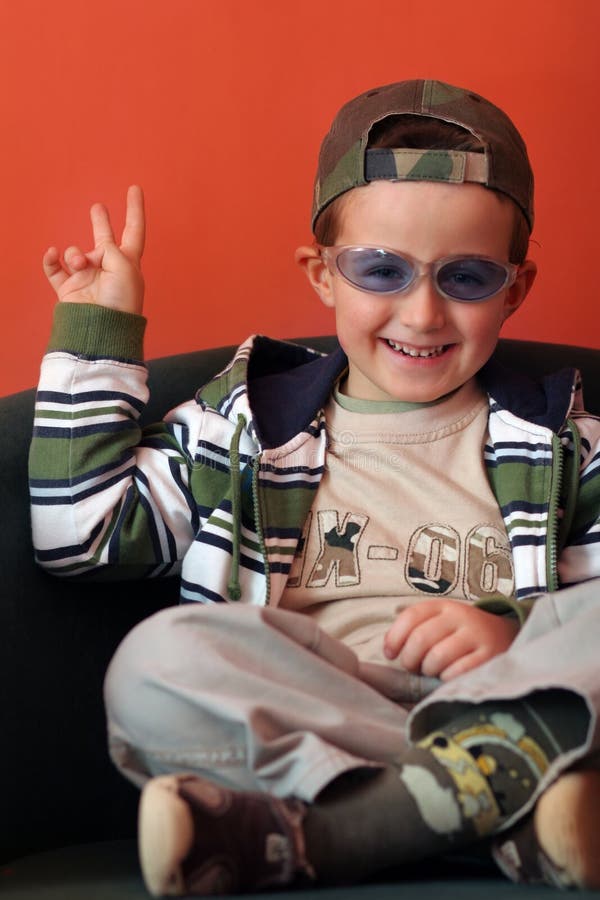 Sitting boy with hand up stock image. Image of wall, hand - 4856567
