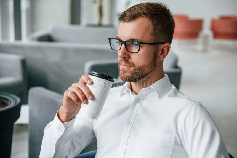 Sitting on the Chair. Elegant Man in Formal Clothes is Indoors Stock ...