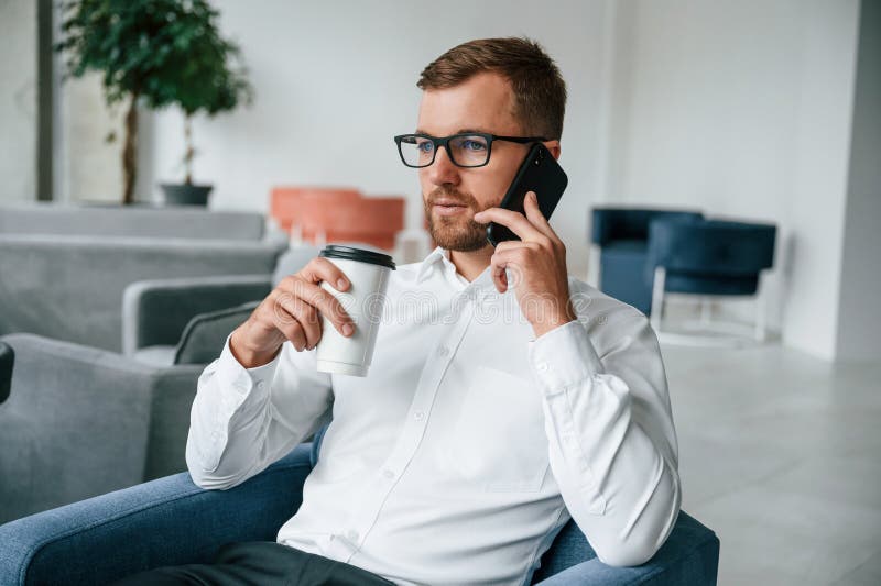 Sitting on the Chair. Elegant Man in Formal Clothes is Indoors Stock ...