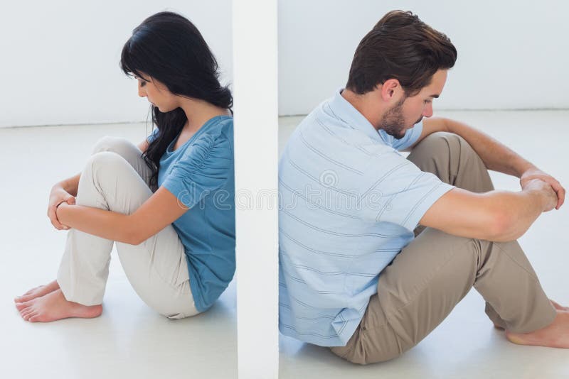 Sitting Couple are Separated by White Wall Stock Photo - Image of male ...