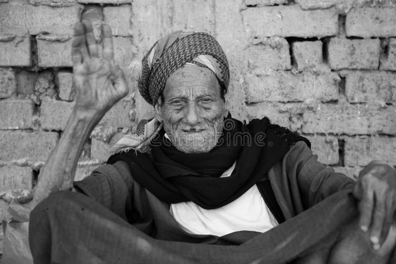Sitting Elder Man Over an Adobe Wall Editorial Stock Image - Image of ...