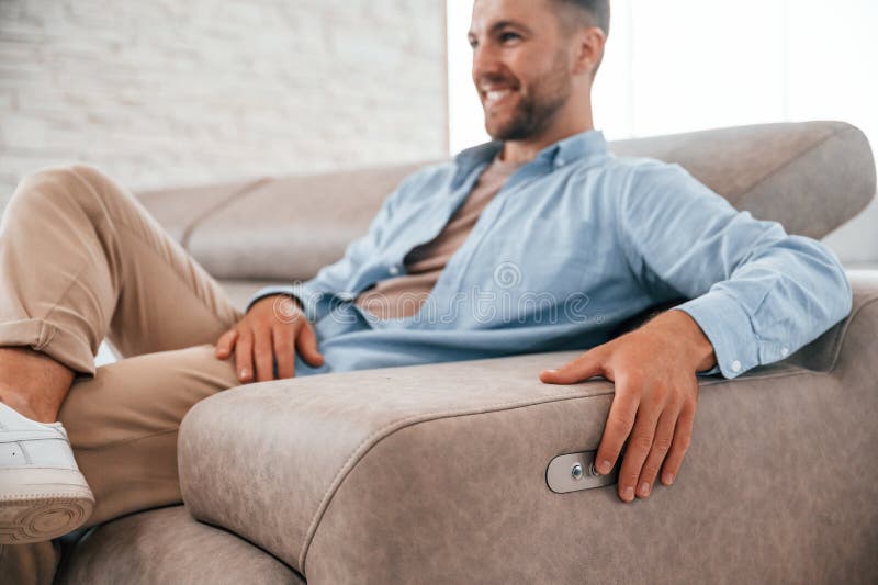 Sitting and Enjoying. Customer Visiting the Sofa and Bed Store Stock ...