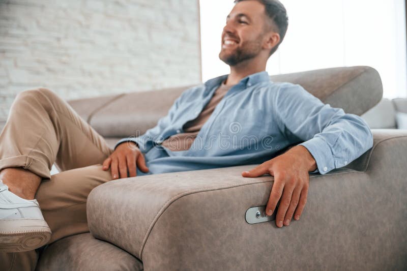Sitting and Enjoying. Customer Visiting the Sofa and Bed Store Stock ...