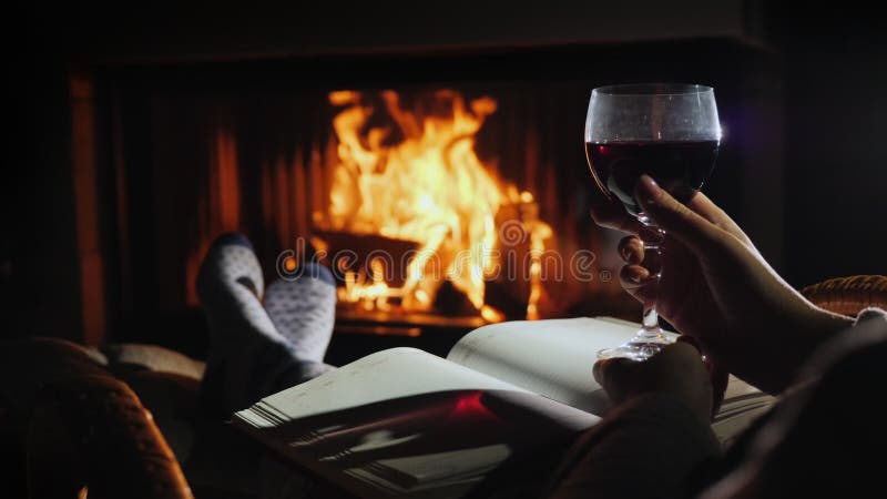 Sitting by the Fireplace with a Blank Notebook and a Glass of Wine ...