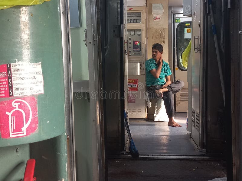 Inside Humsafar Train, Worker is Sitting by the Gate Editorial Stock ...