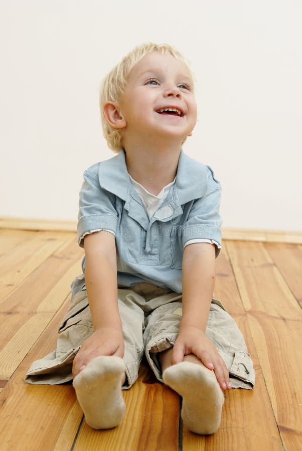 Sitting little boy stock image. Image of male, smile - 12093349