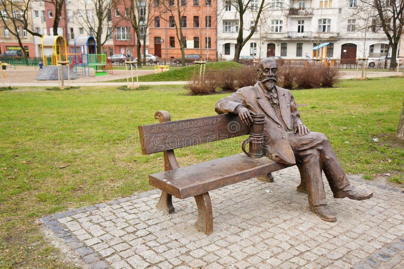 Sitting man statue stock image. Image of grass, statue - 36296371