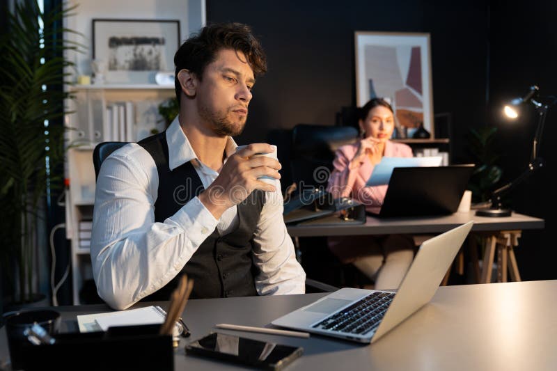Sitting Man Working on Laptop Waiting Email while Holding Coffee Cup ...