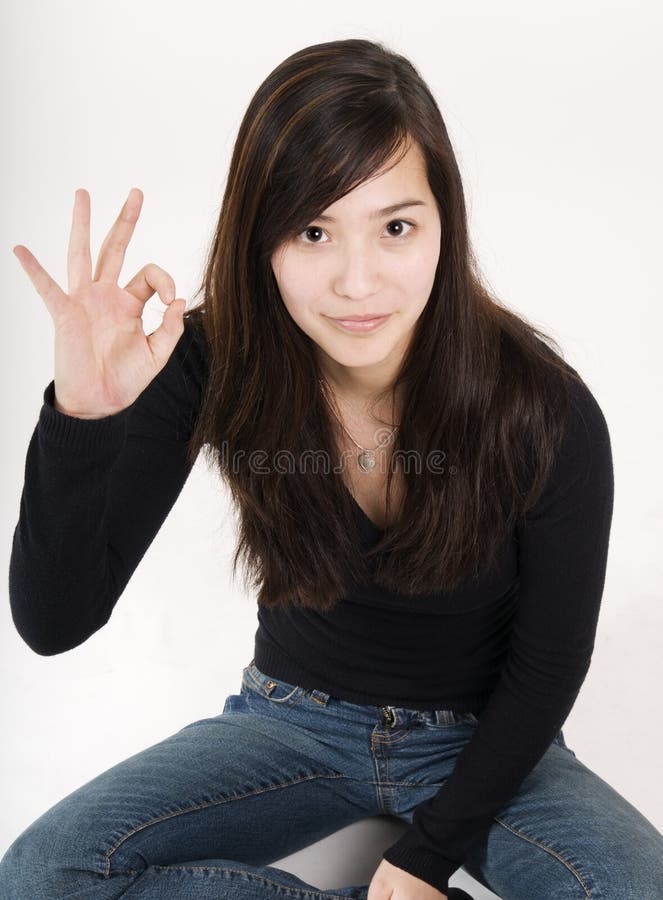 Sitting with OK sign stock photo. Image of adult, beauty - 6020592