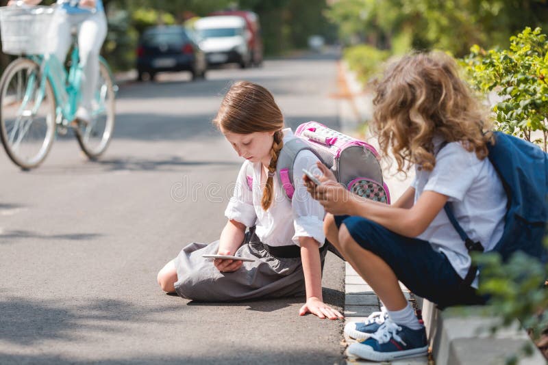 Sitting on a pavement stock image. Image of kids, student - 171983745