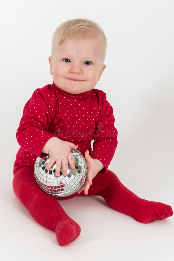 Sitting Smiling Baby in Red with Party Ball Stock Photo - Image of ...