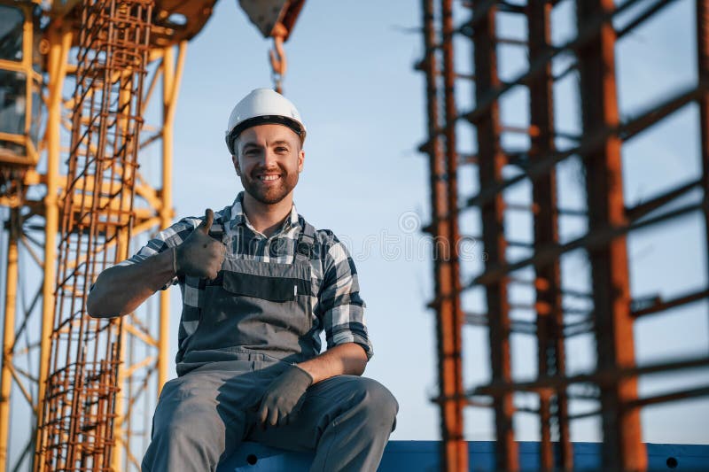 Sitting and Smiling. Man is Working on the Construction Site at Daytime ...
