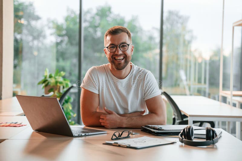 Sitting and Smiling. Positive Man in Formal Clothes is Working in the ...