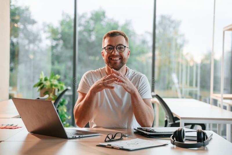 Sitting and Smiling. Positive Man in Formal Clothes is Working in the ...