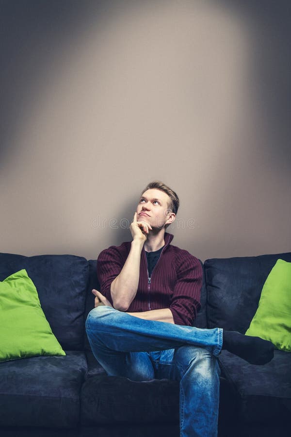 Sitting on sofa thinking stock image. Image of apartment - 39714099