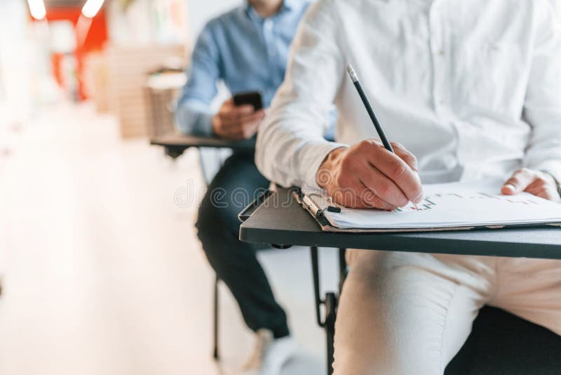 Sitting by the Tables and Learning New Stuff. Group of Professional ...