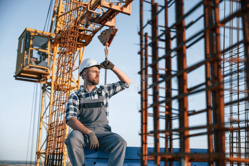 Sitting and Taking a Break. Man is Working on the Construction Site at ...