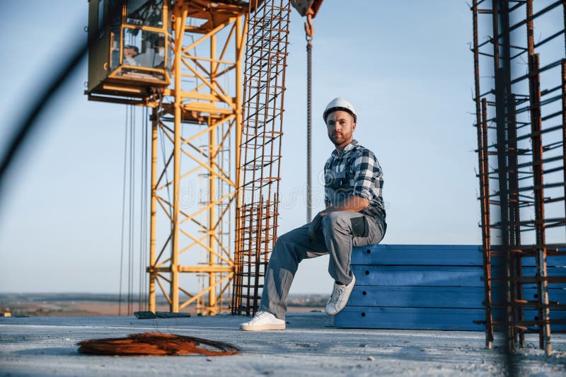 Sitting and Taking a Break. Man is Working on the Construction Site at ...