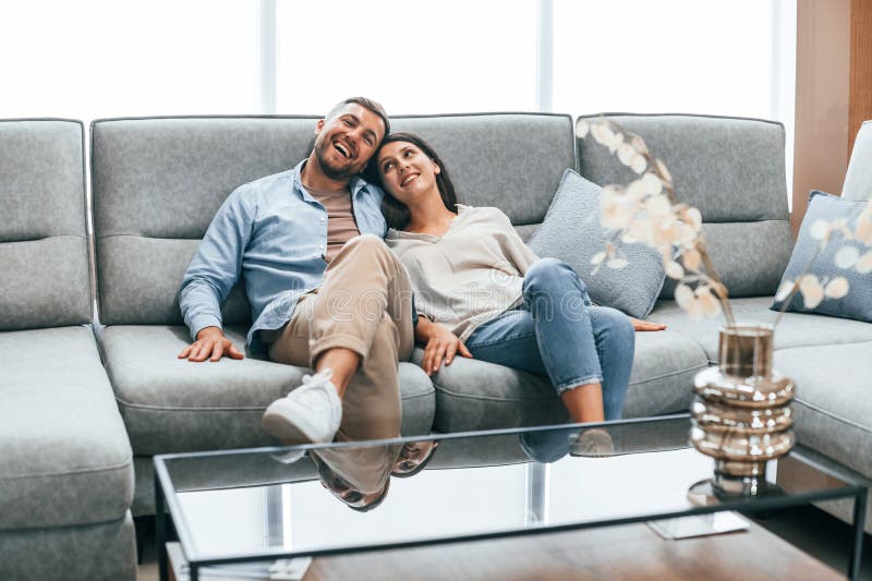 Sitting and Testing Product. Couple Choosing the Sofa and Bed in the ...